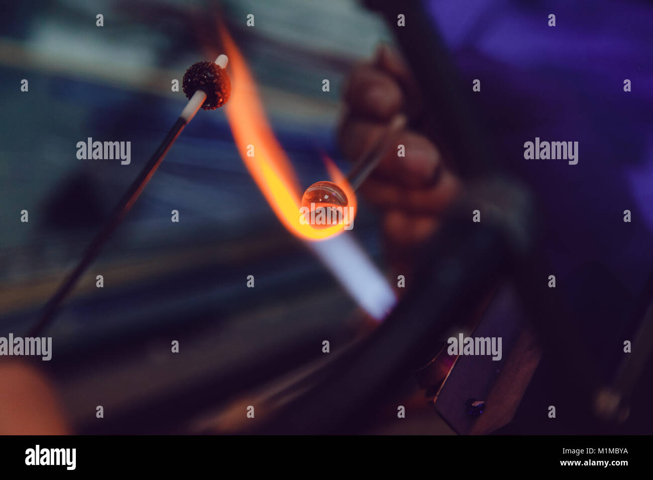 Process of manufacturing costume jewelery from Venetian glass Stock ...