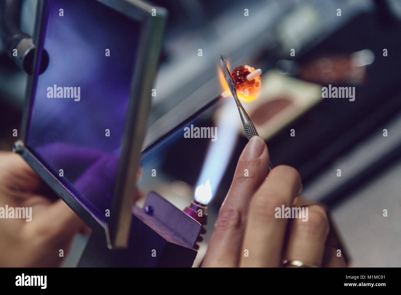 Process of manufacturing costume jewelery from Venetian glass Stock ...