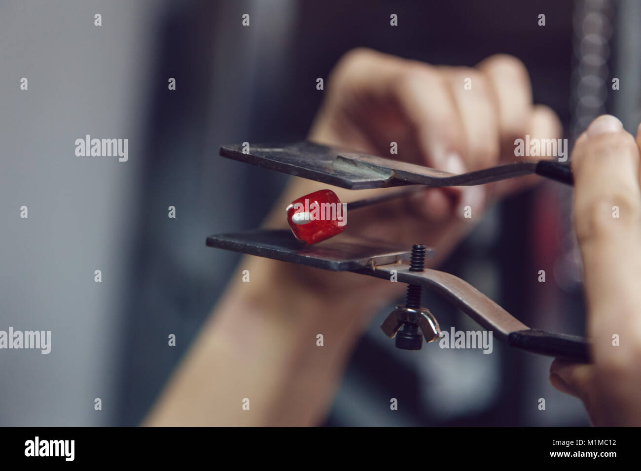 Process of manufacturing costume jewelery from Venetian glass Stock ...