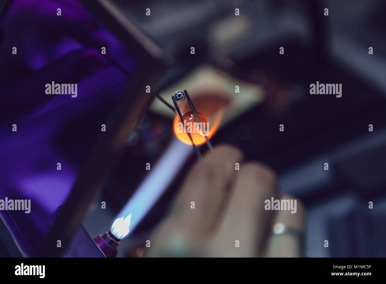 Process of manufacturing costume jewelery from Venetian glass Stock ...