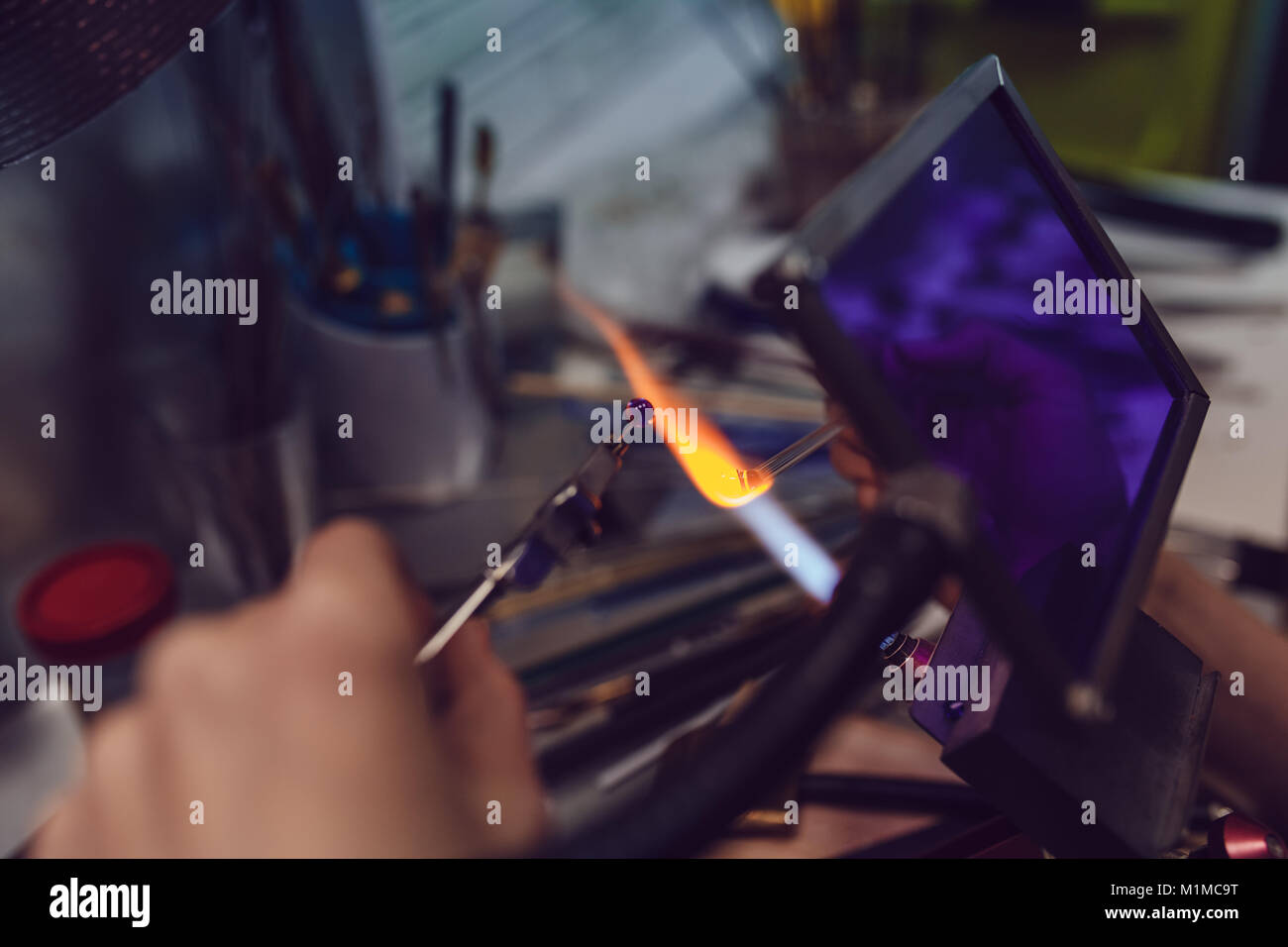 Process of manufacturing costume jewelery from Venetian glass Stock ...