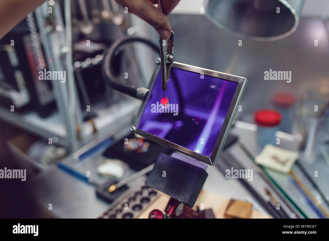 Process of manufacturing costume jewelery from Venetian glass Stock ...