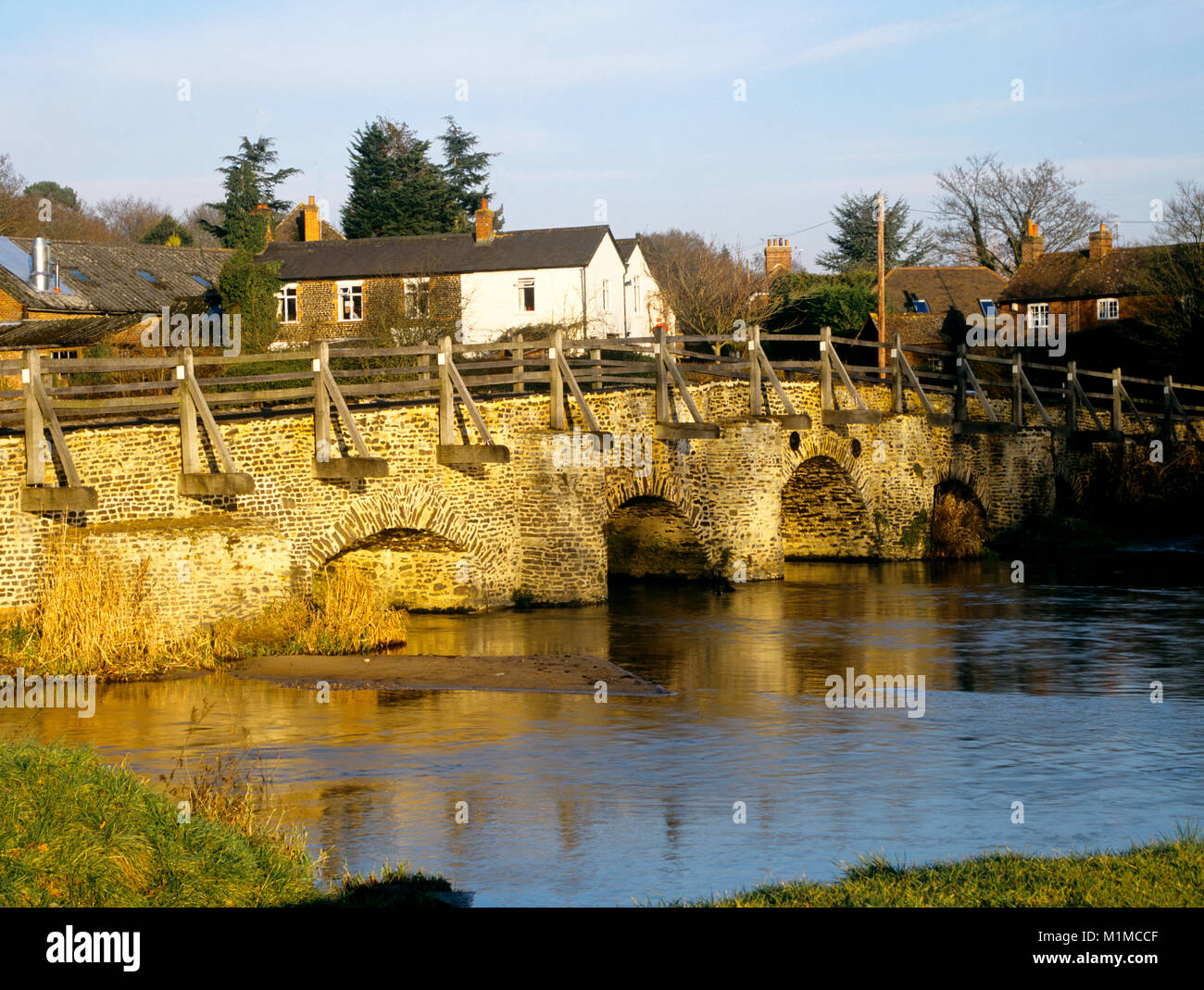 Old narrow hump backed bridge over River Wey Tilford Surrey England UK ...