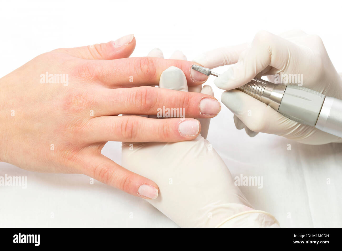 The process of the master's work in the manicure salon of female nails ...