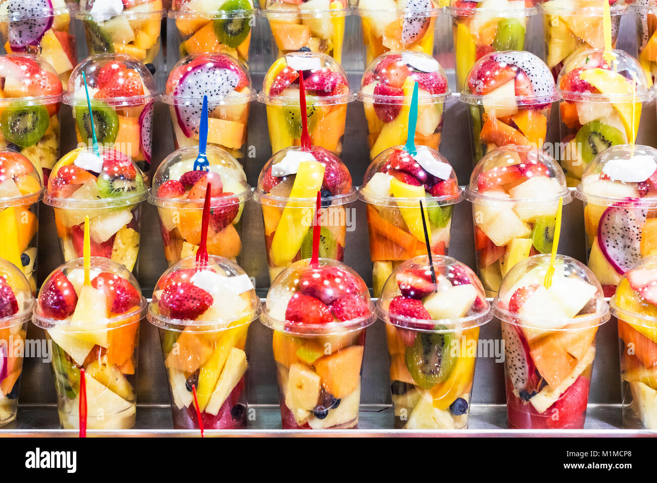 Salad sliced from fresh fruit in a plastic cup Stock Photo - Alamy