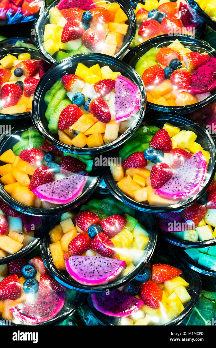 Salad sliced from fresh fruit in a plastic cup Stock Photo - Alamy