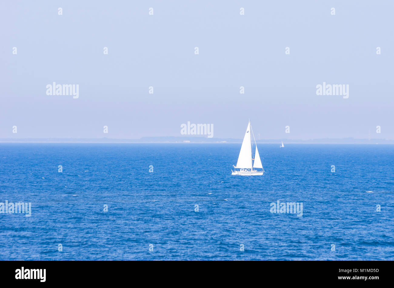 Single sailing boat on open sea Stock Photo - Alamy