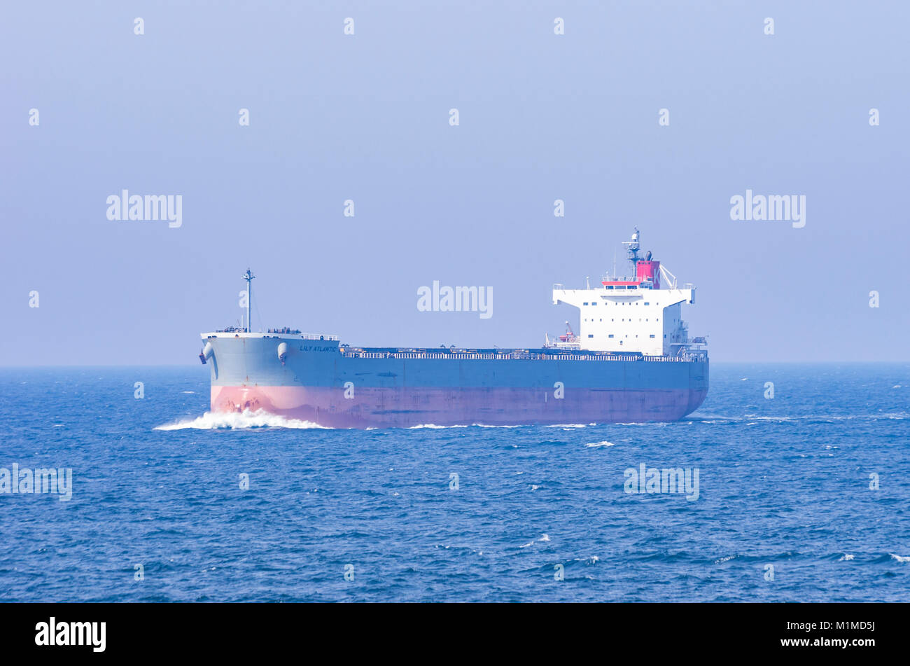 A cargo ship, the bulk carrier LILY ATLANTIC is in the process of ...