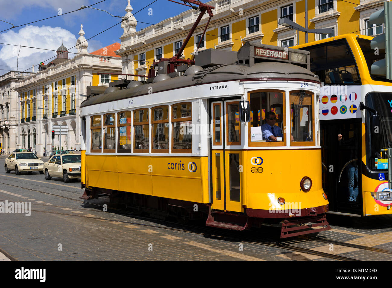 The popular Public transport - the electric tram with commuters, Lisbon ...