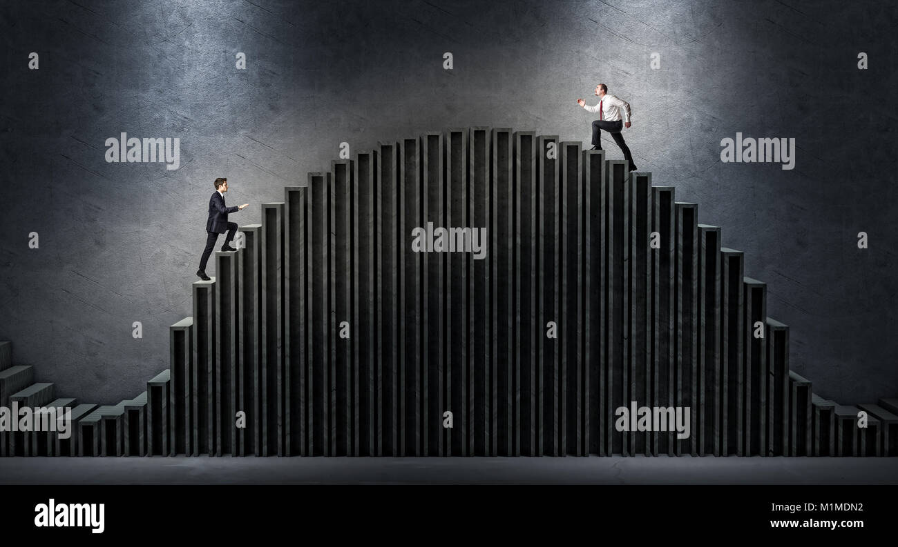 two businessmen compete to get to the top of the stair Stock Photo - Alamy