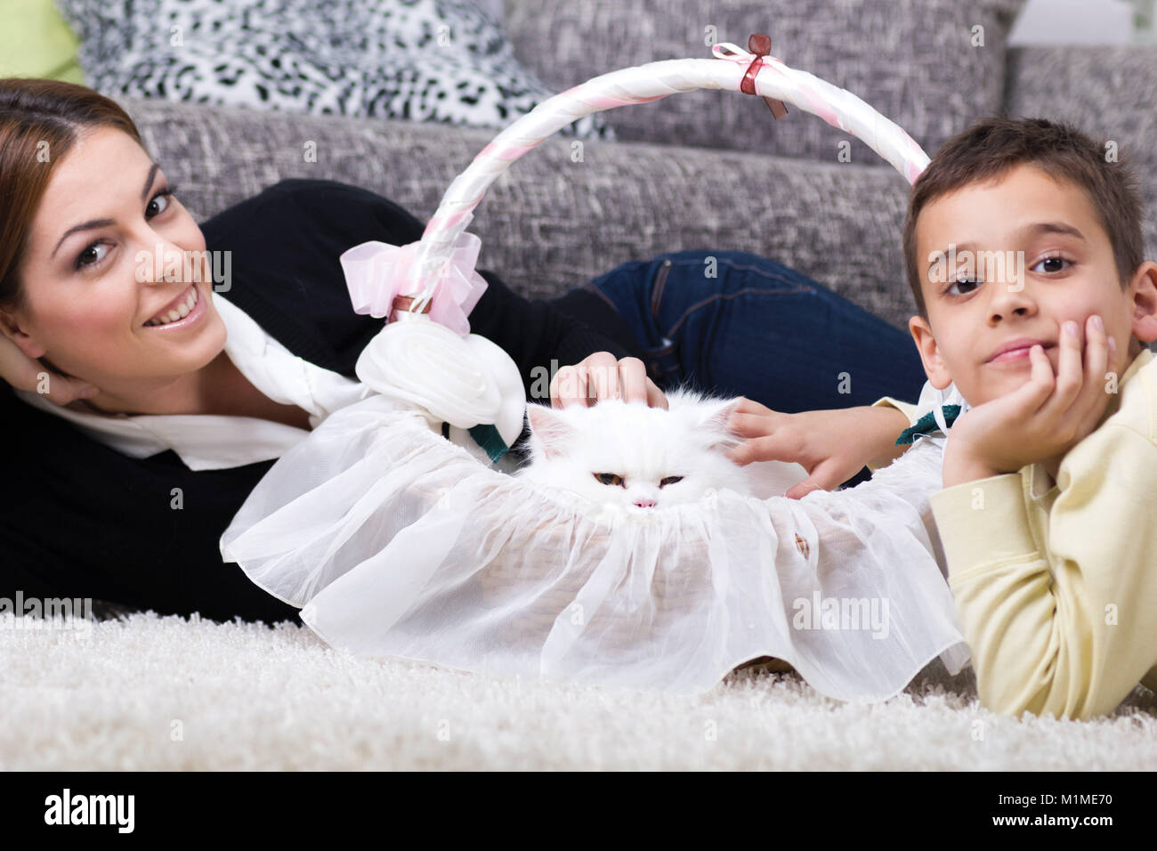 mother and child together caress Persian cat at home Stock Photo - Alamy