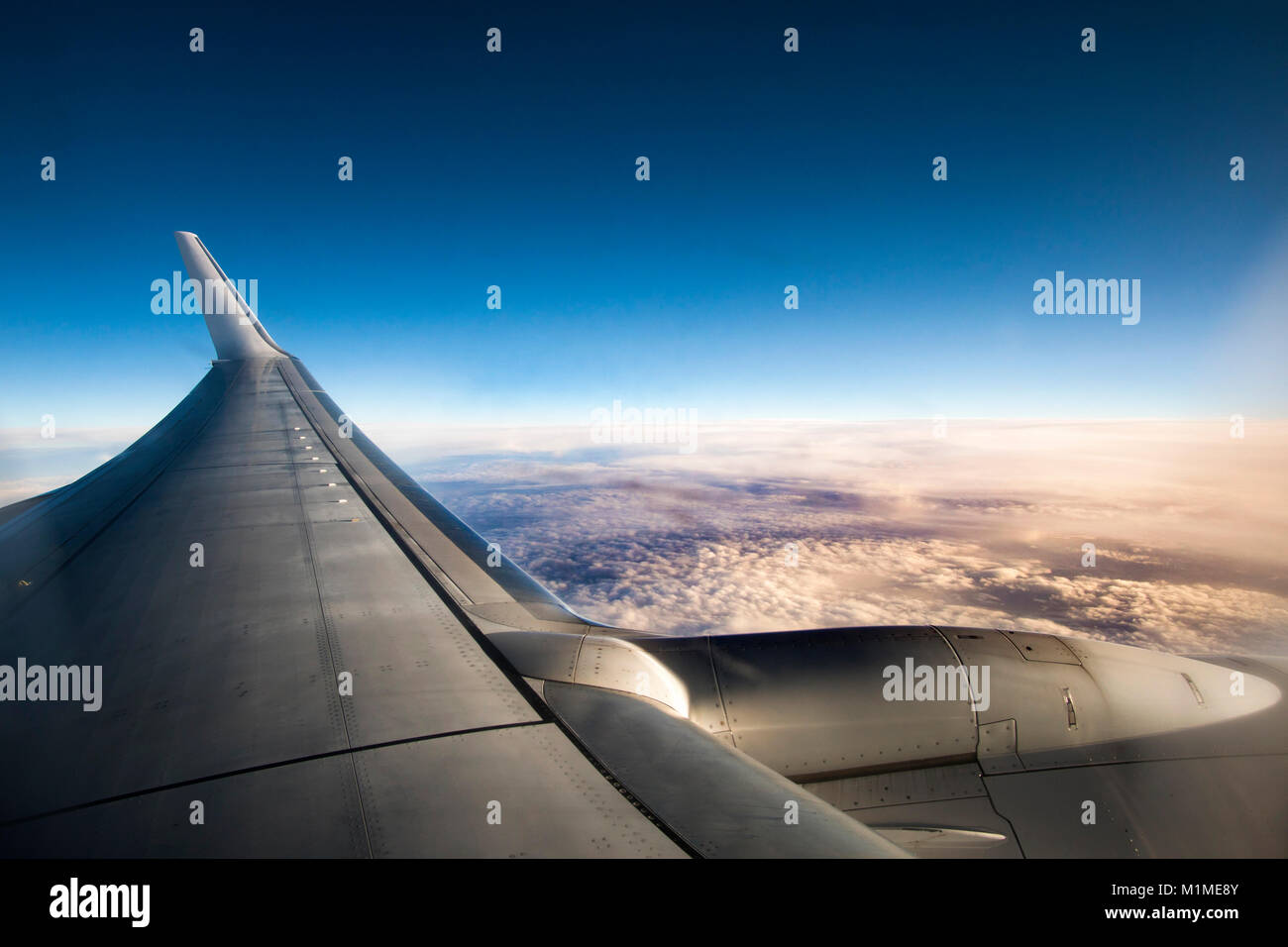 View above the clouds from an airplane during the flight Stock Photo ...