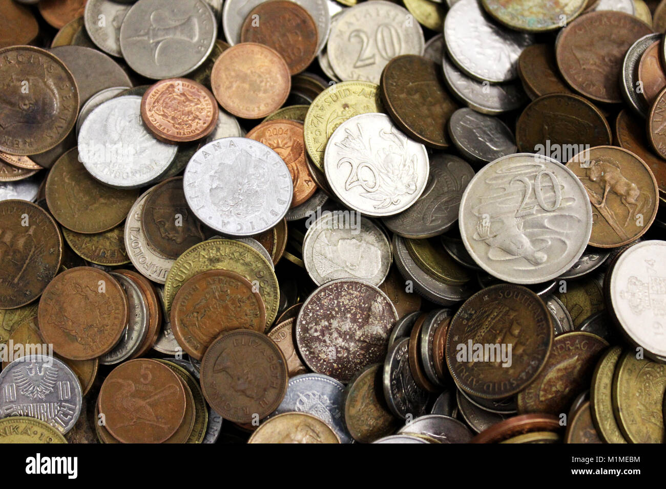 Various metal coins of different curriencies Stock Photo - Alamy