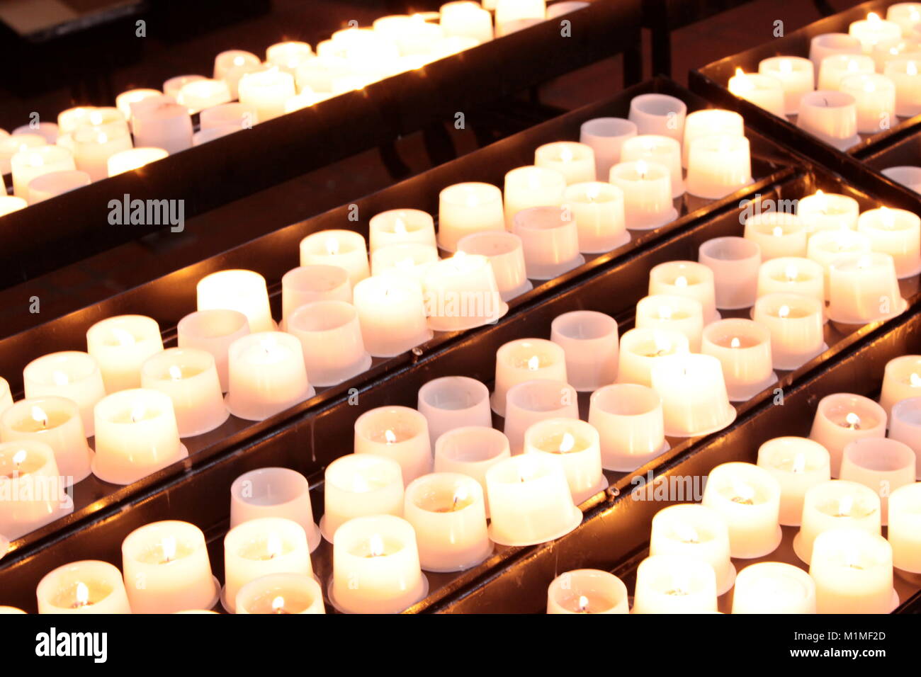 Church Candles alight in Catholic Church Stock Photo - Alamy