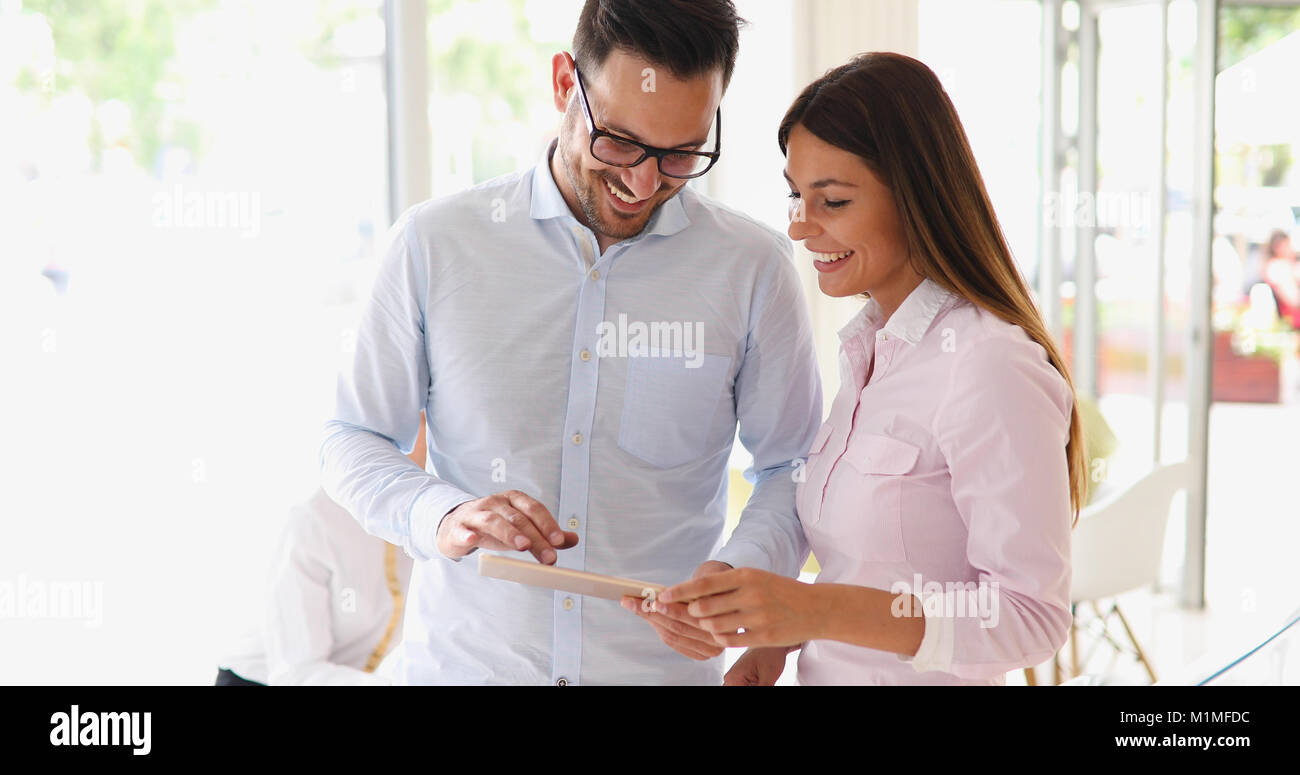 Happy business colleagues in modern office Stock Photo - Alamy