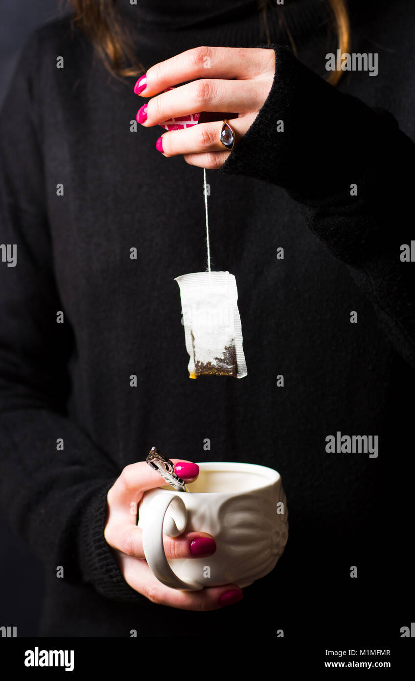 Woman hand teabag hi-res stock photography and images - Alamy