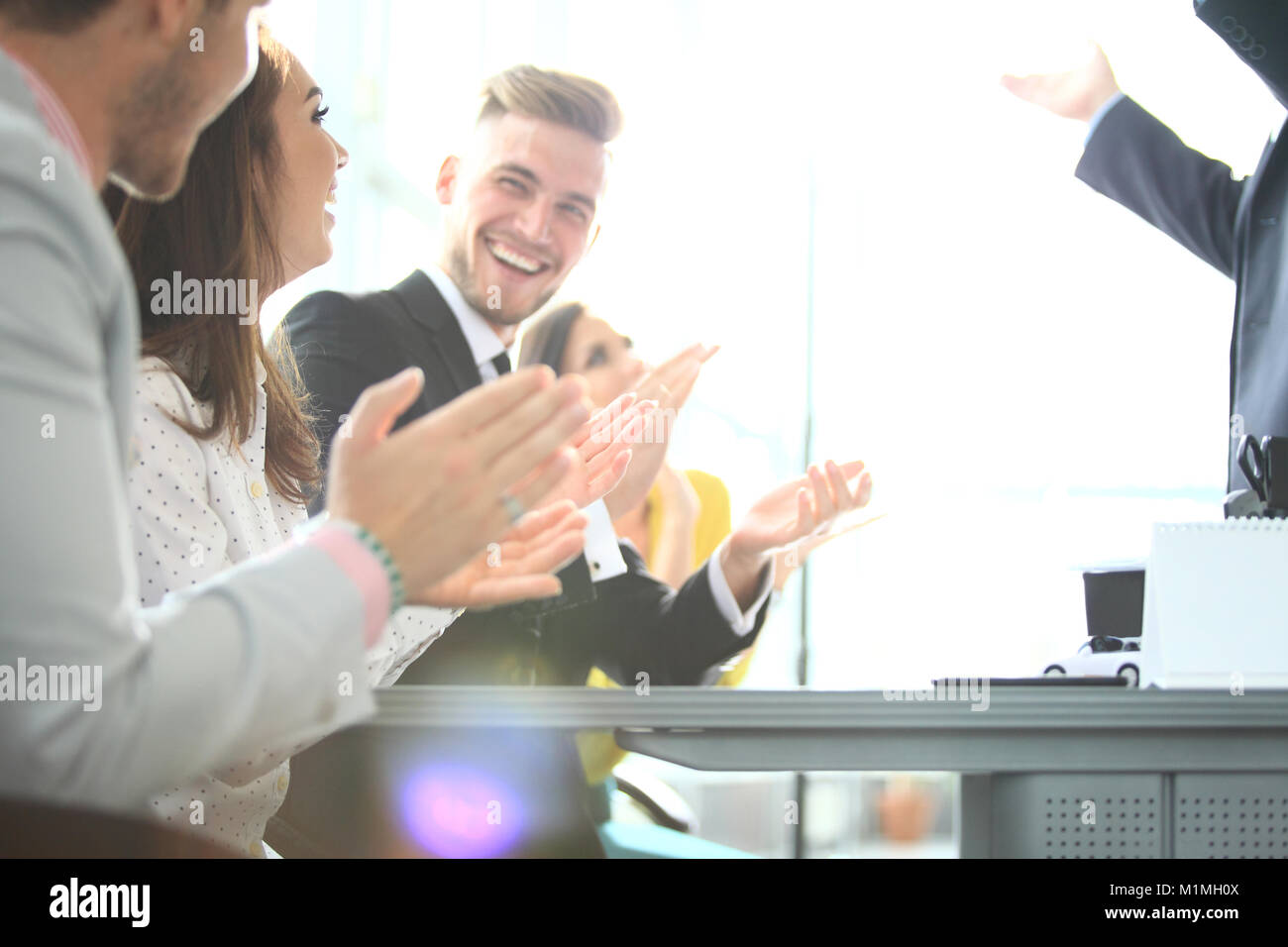 Photo of partners clapping hands after business seminar. Professional ...