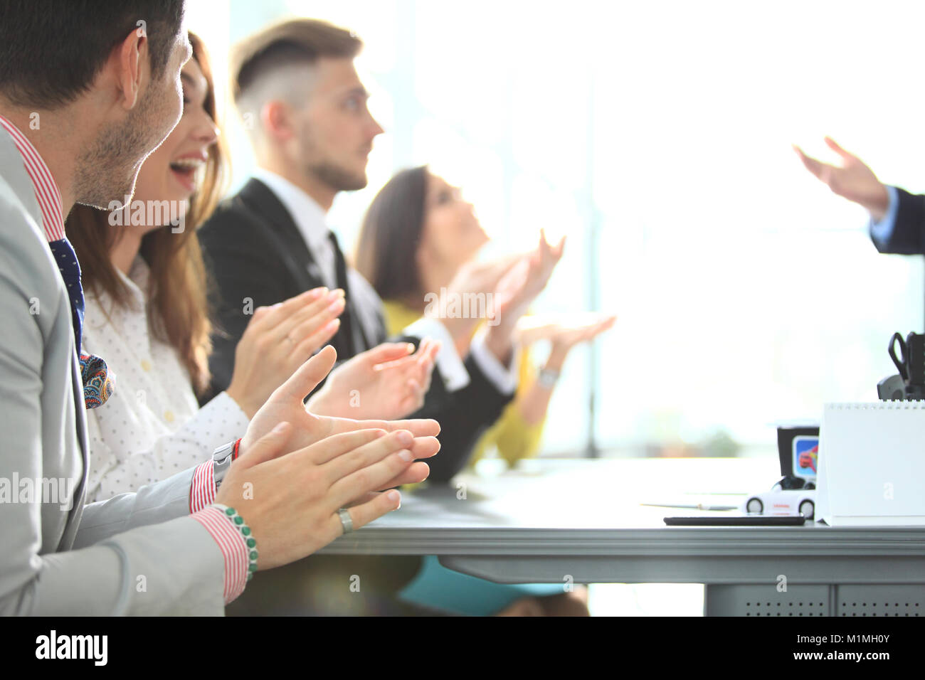 Photo of partners clapping hands after business seminar. Professional ...