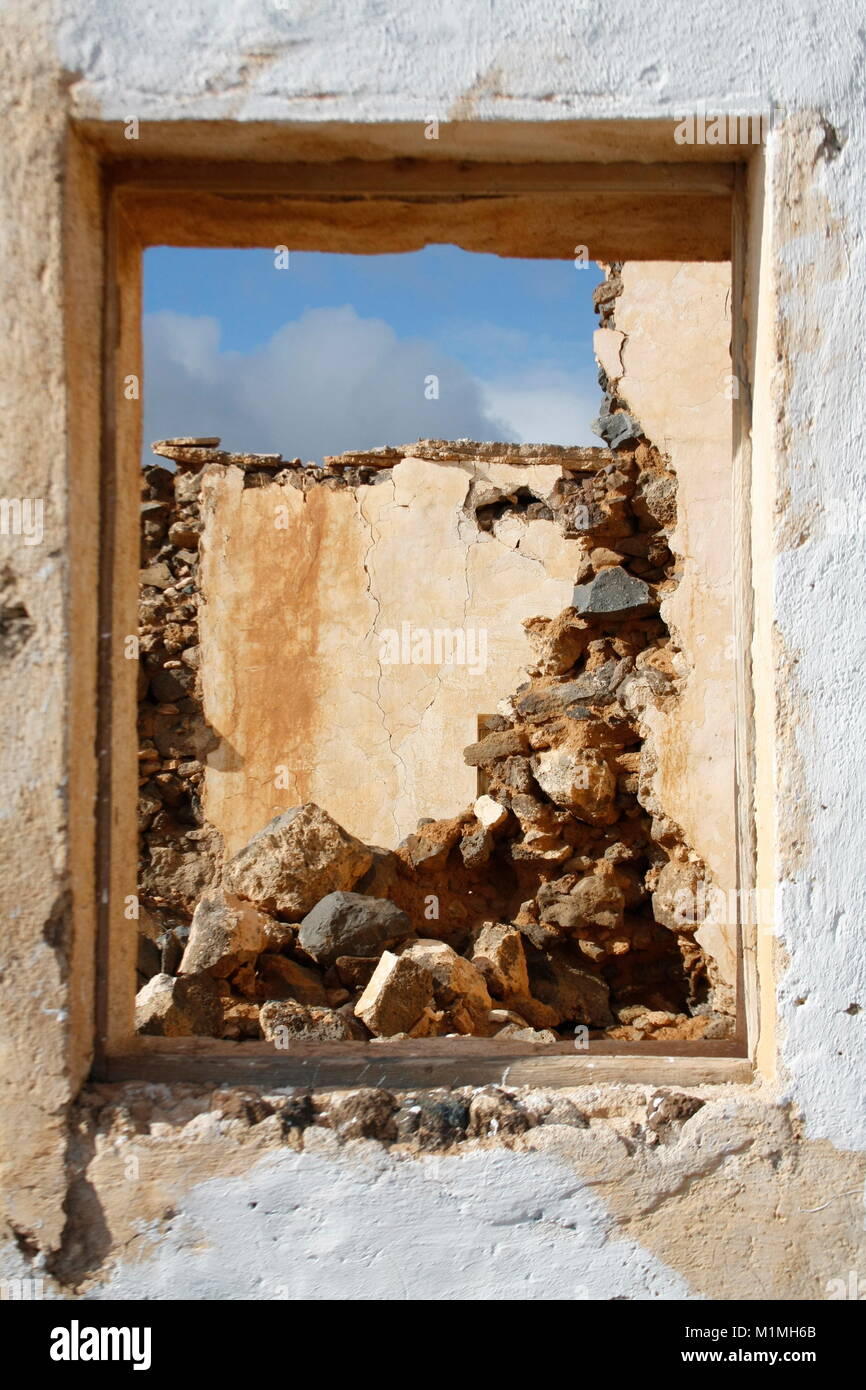 Old abandoned building, scraped wall, no window blue sky Stock Photo ...
