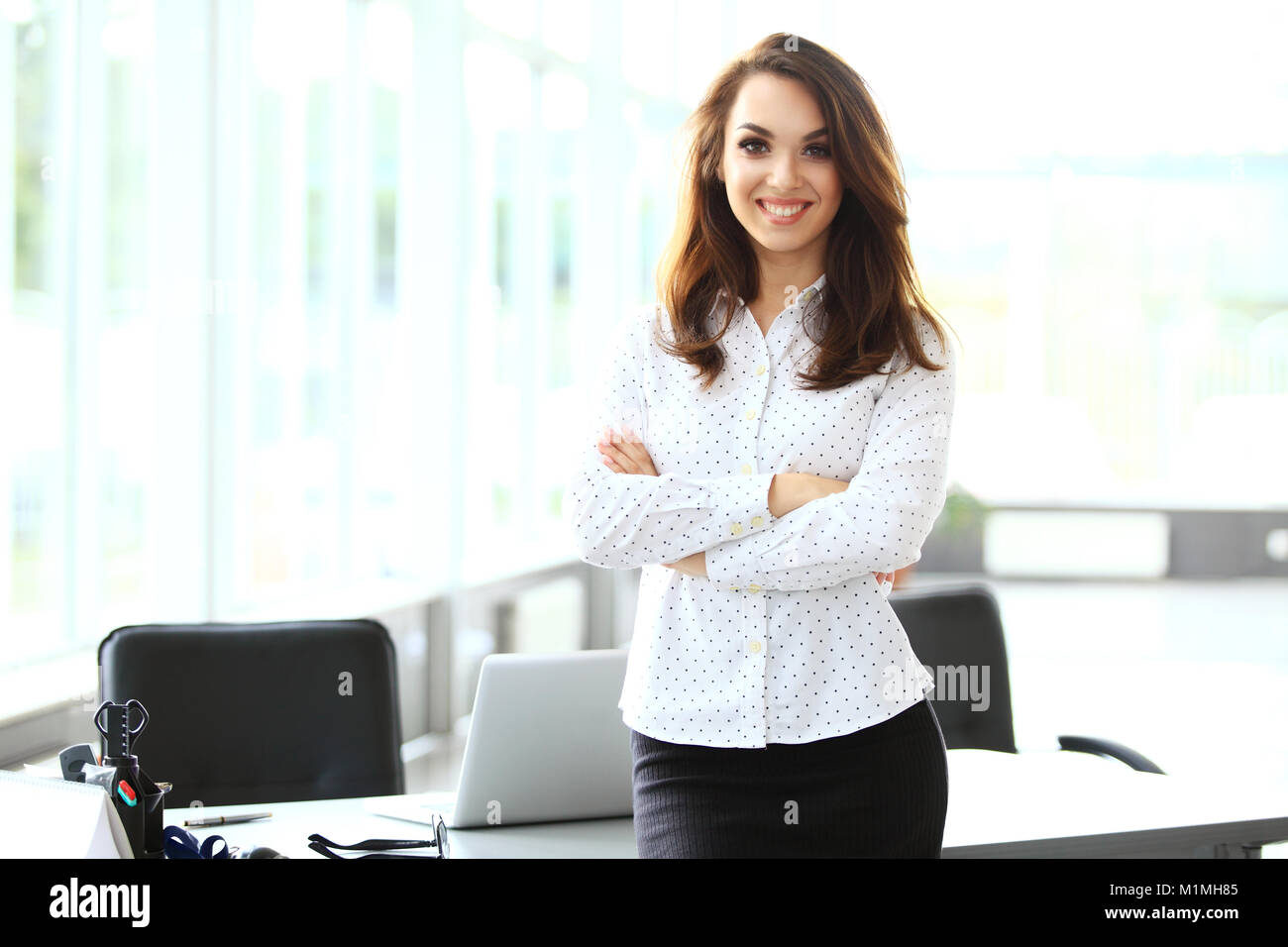 Modern business woman in the office with copy space Stock Photo - Alamy