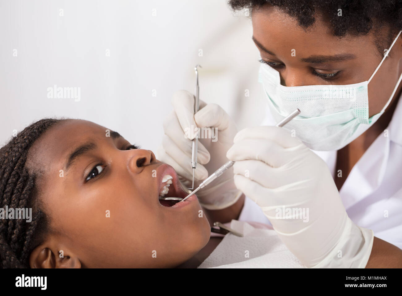 Close-up Of Girl With Open Mouth During Oral Checkup At The Dentist ...