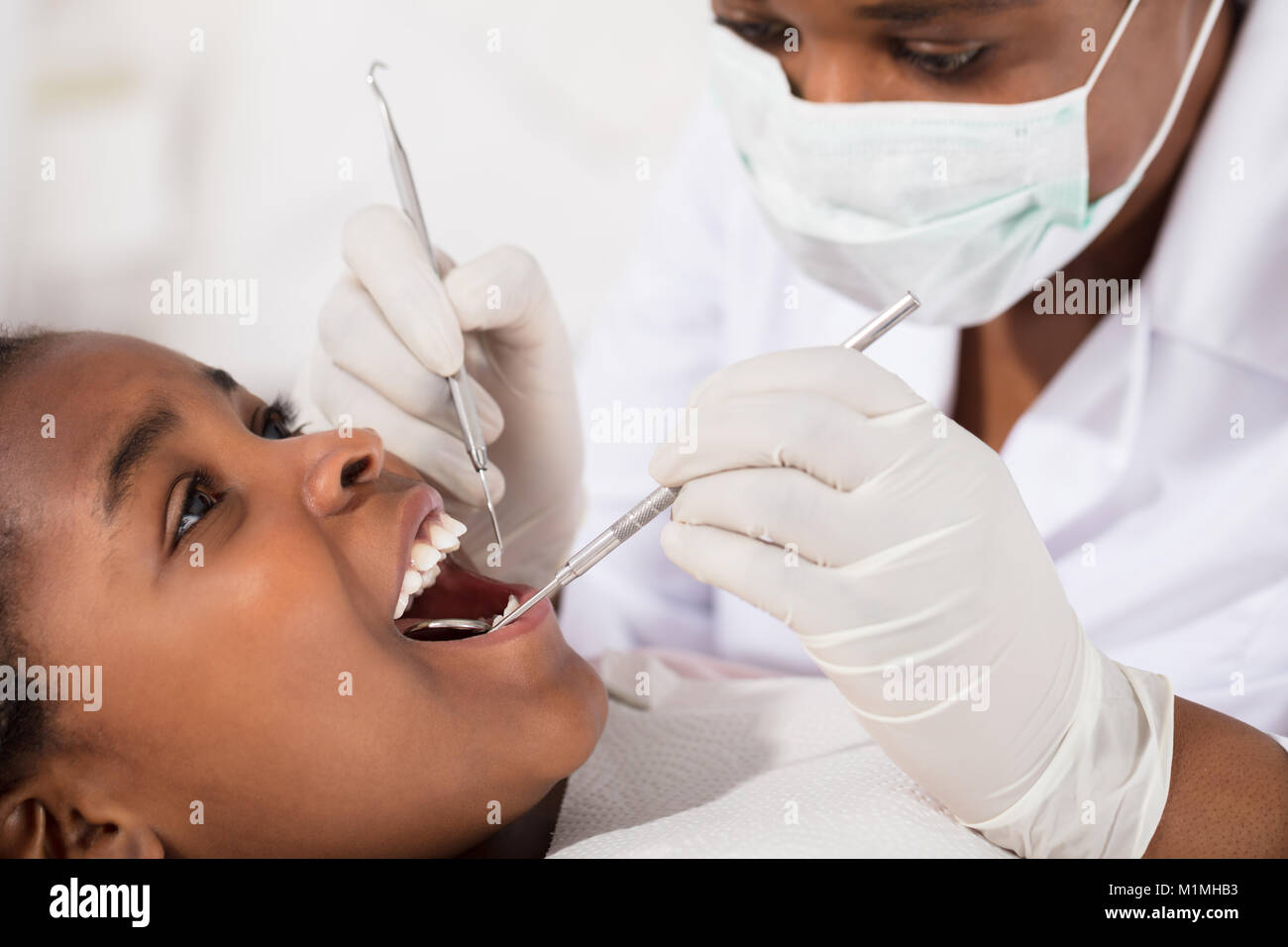 Close-up Of Girl With Open Mouth During Oral Checkup At The Dentist ...