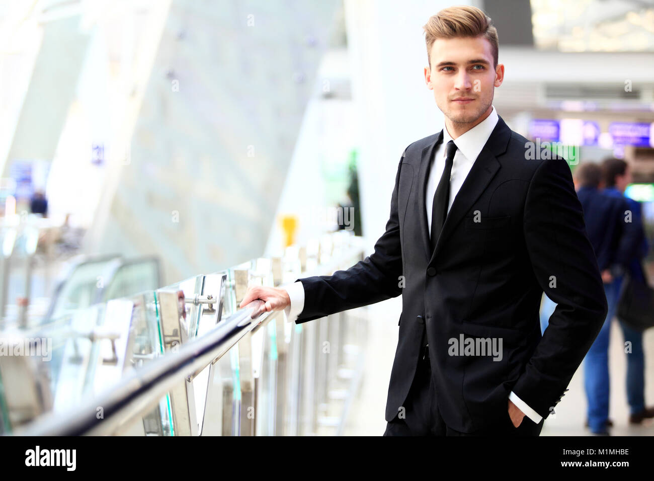 Handsome smiling confident businessman portrait Stock Photo - Alamy