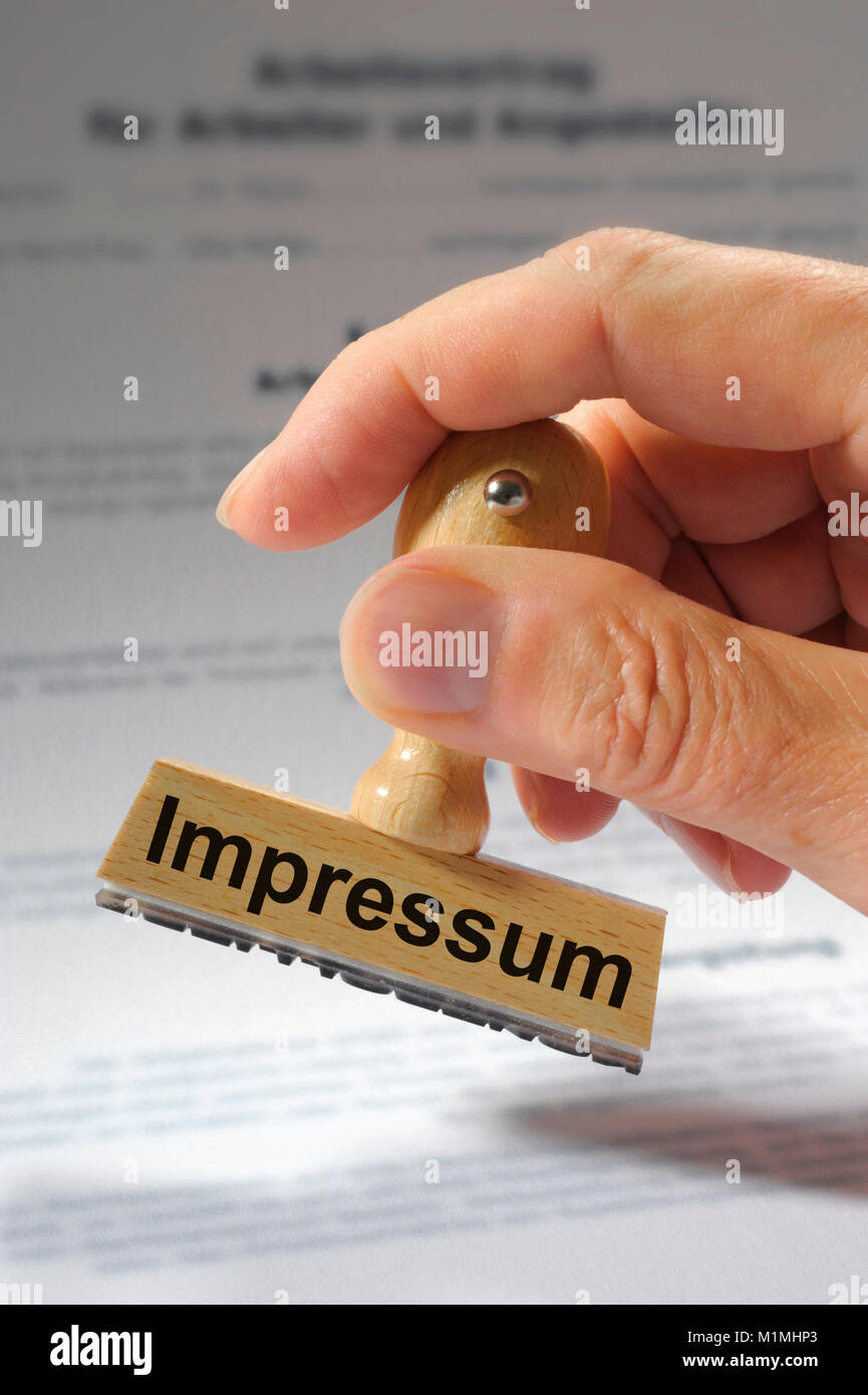 Impressum marked on rubber stamp Stock Photo - Alamy