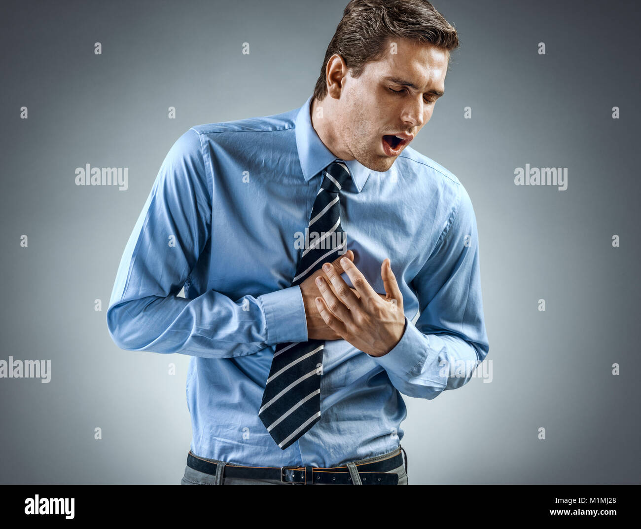Office manager having heart attack. Medical concept Stock Photo - Alamy