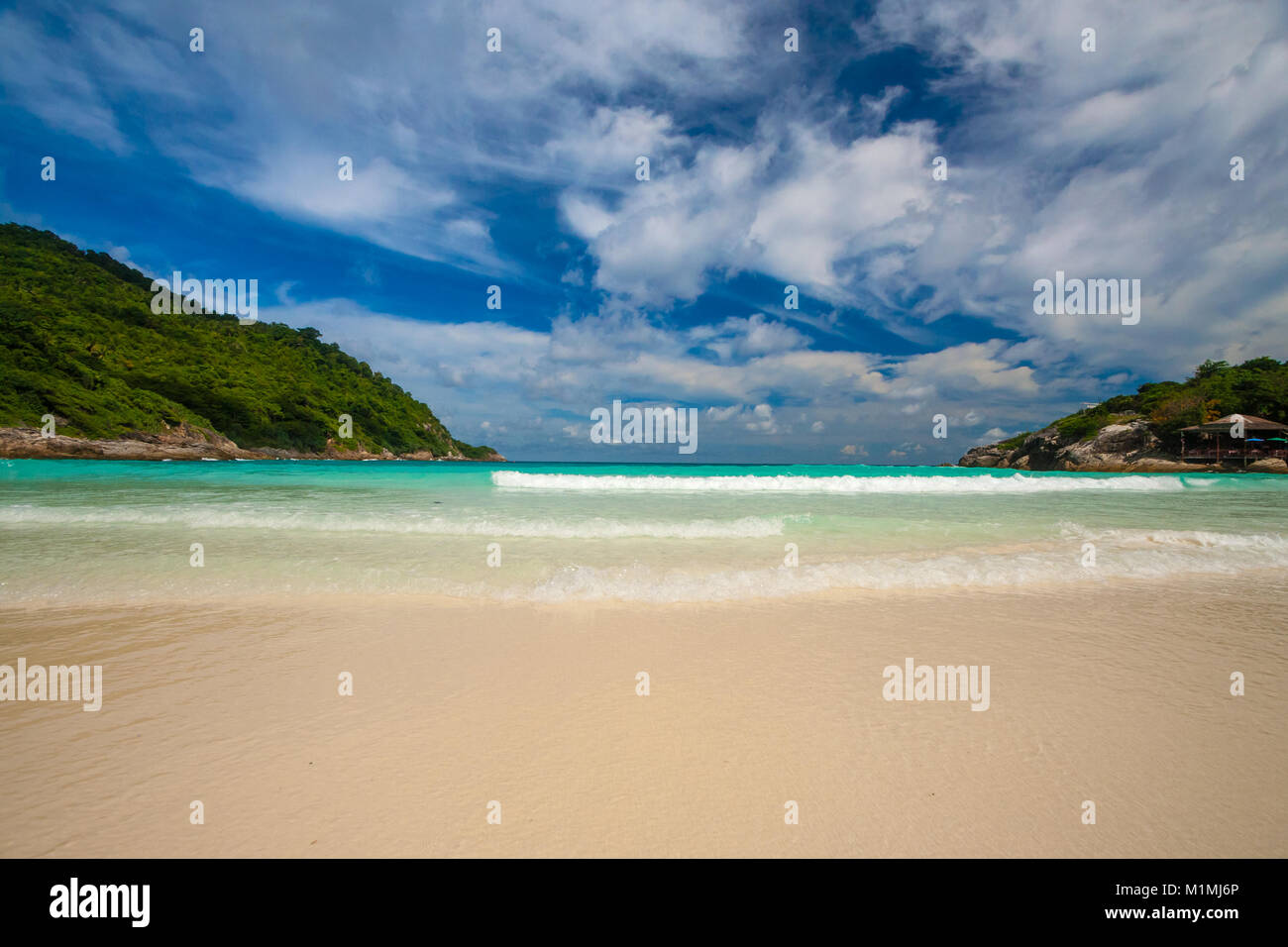 The beautiful dreamlike beach of Siam Bay, flanked by hills, on Ko ...