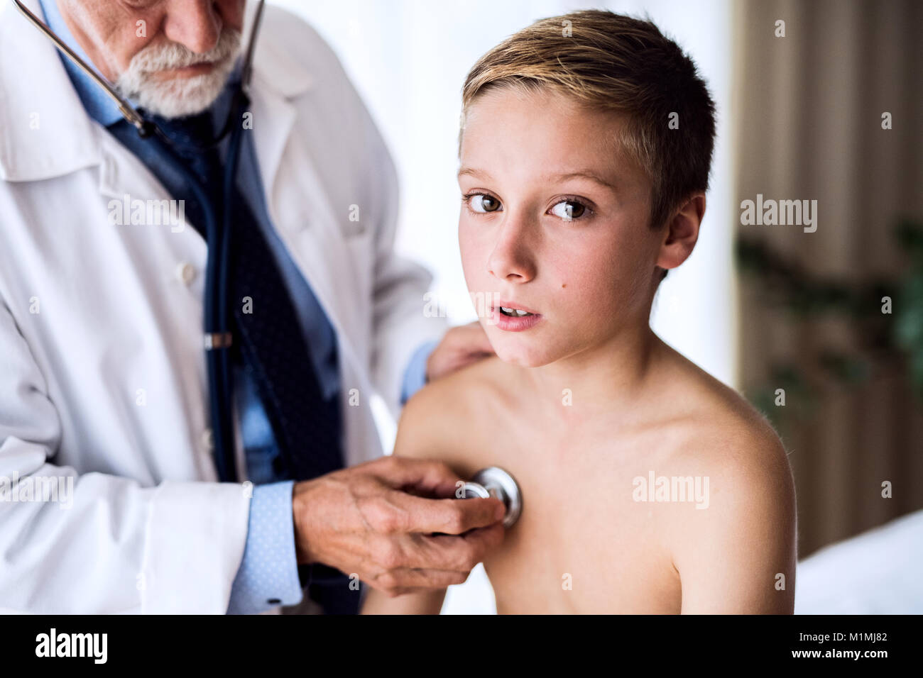 Senior man in check shirt hi-res stock photography and images - Alamy