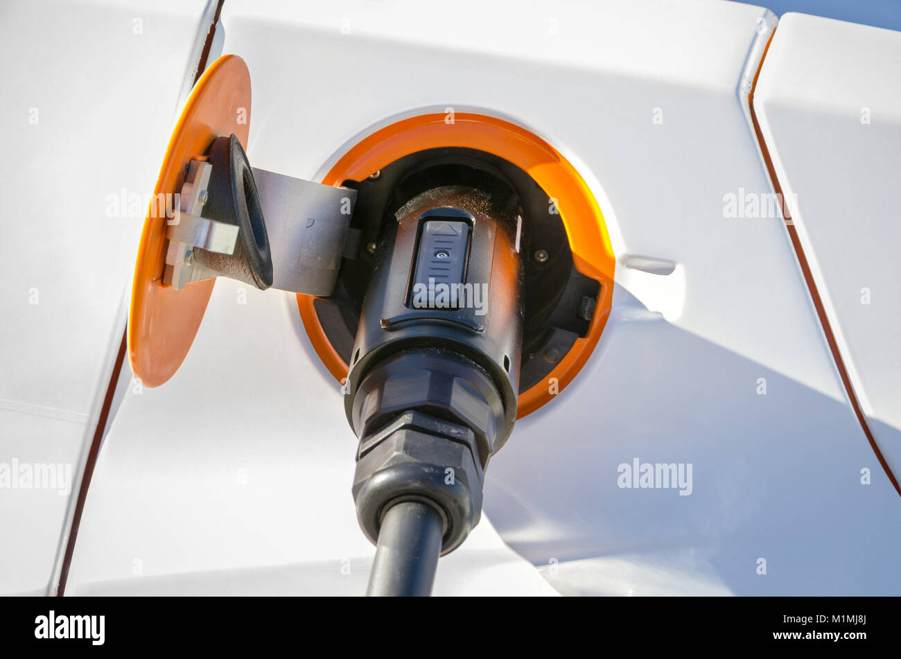 Electricity plug for electric vehicle hi-res stock photography and ...