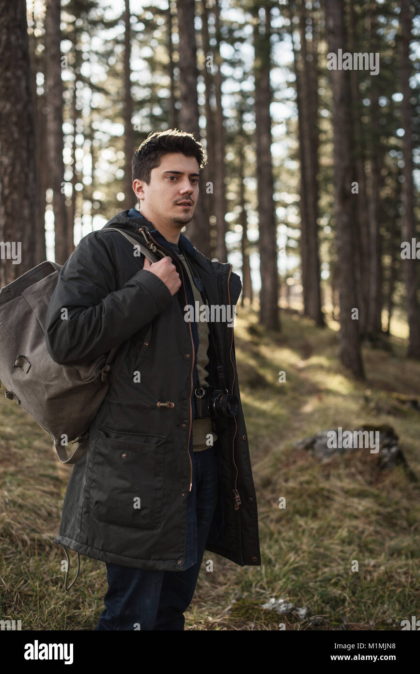 Young man carrying a backpack hi-res stock photography and images - Alamy