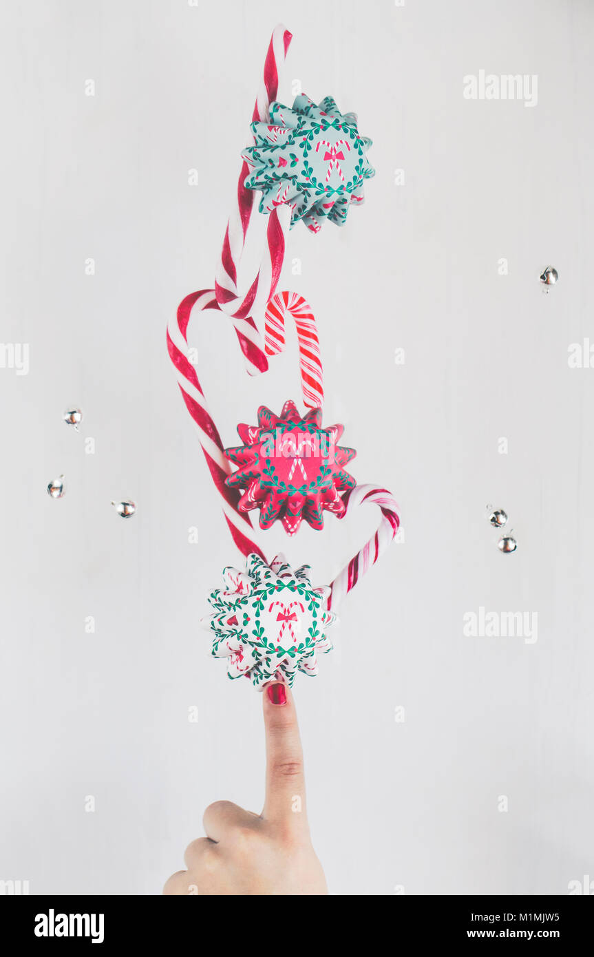Boy balancing Christmas candy canes on his finger Stock Photo - Alamy