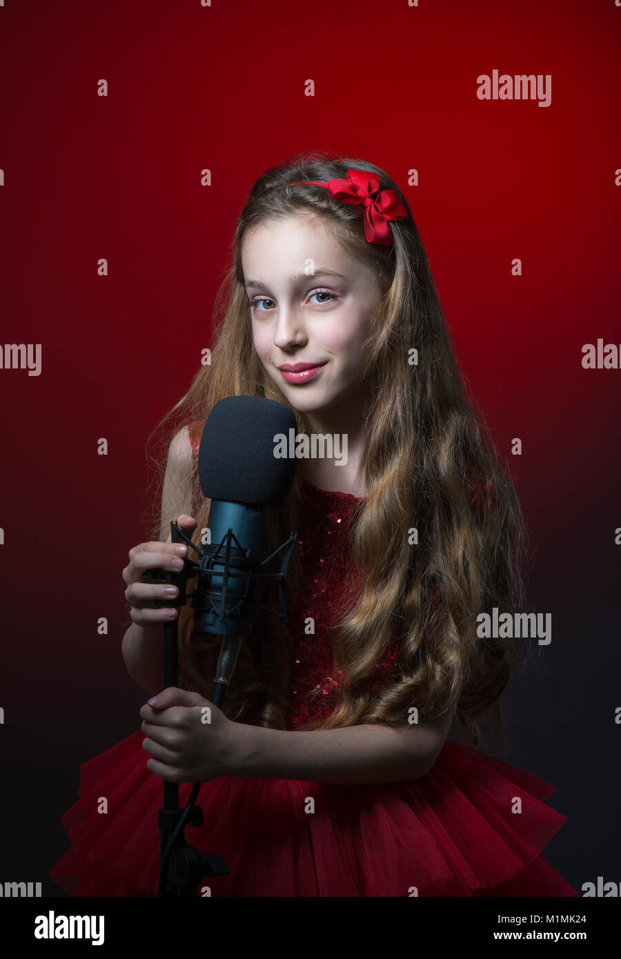 Portrait of a girl with a microphone Stock Photo - Alamy