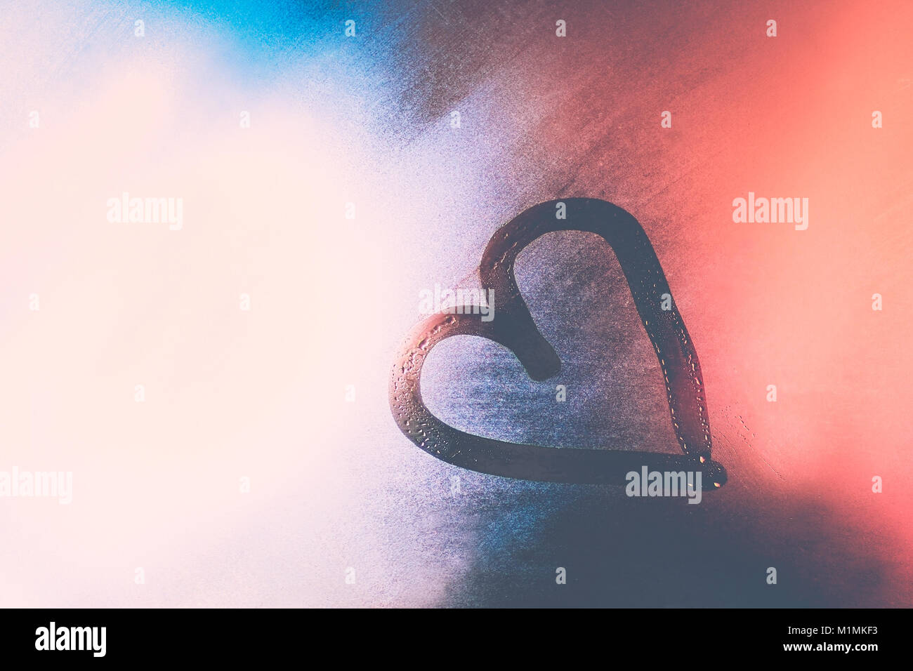 Abstract colorful love background, hand drawing of heart on the misted ...