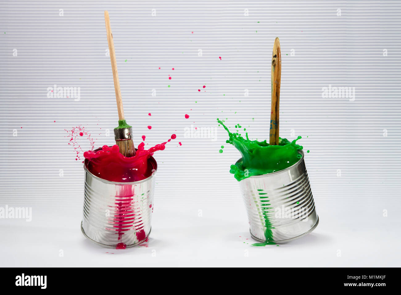 Metal tin can with green and red acrylic paint Stock Photo - Alamy