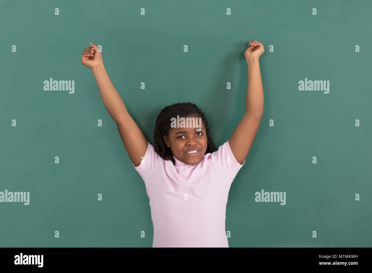 African american girl raising hand hi-res stock photography and images ...