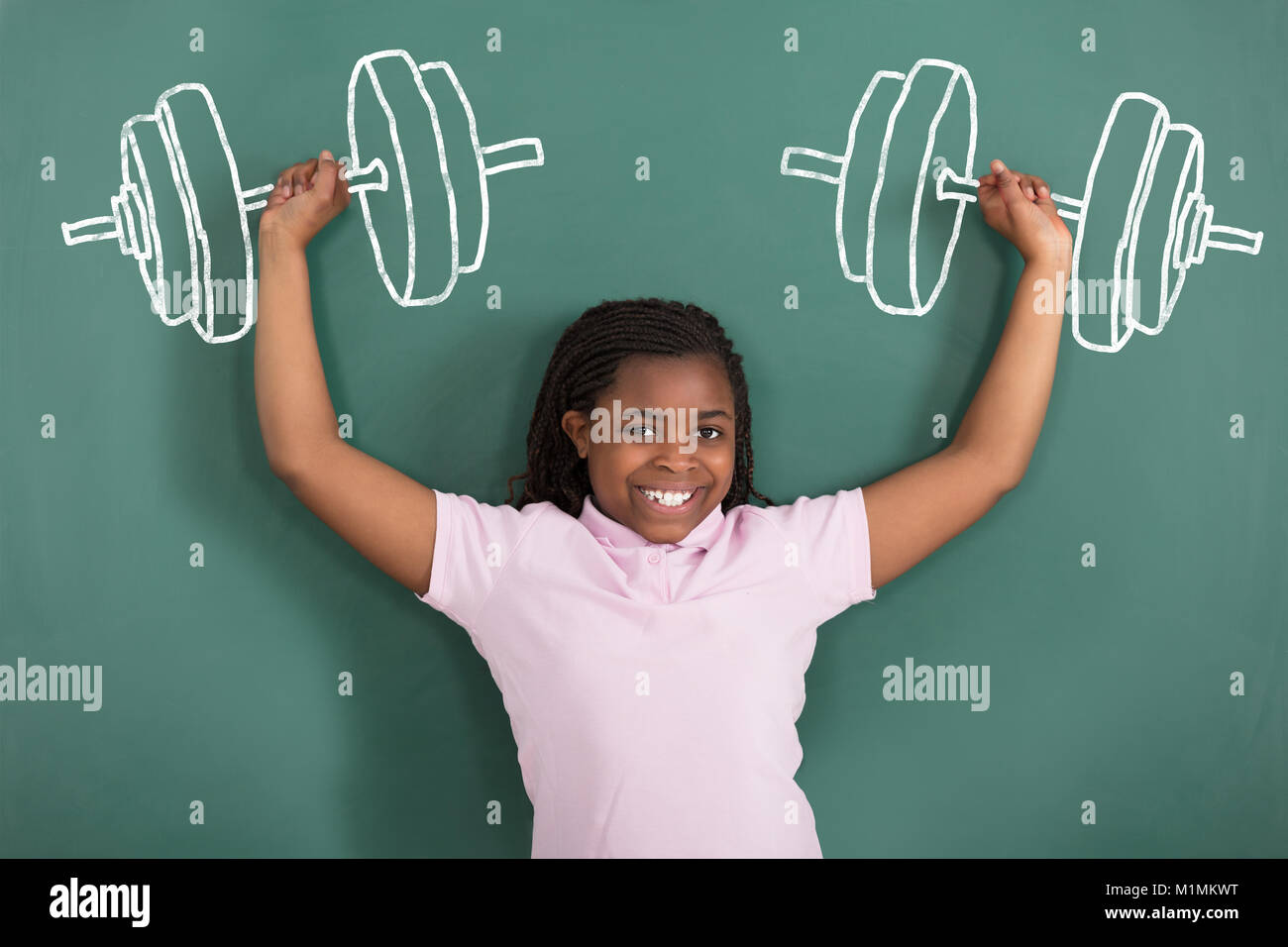 Smiling Girl Lifting Weights Drawn On A Green Chalkboard Stock Photo ...