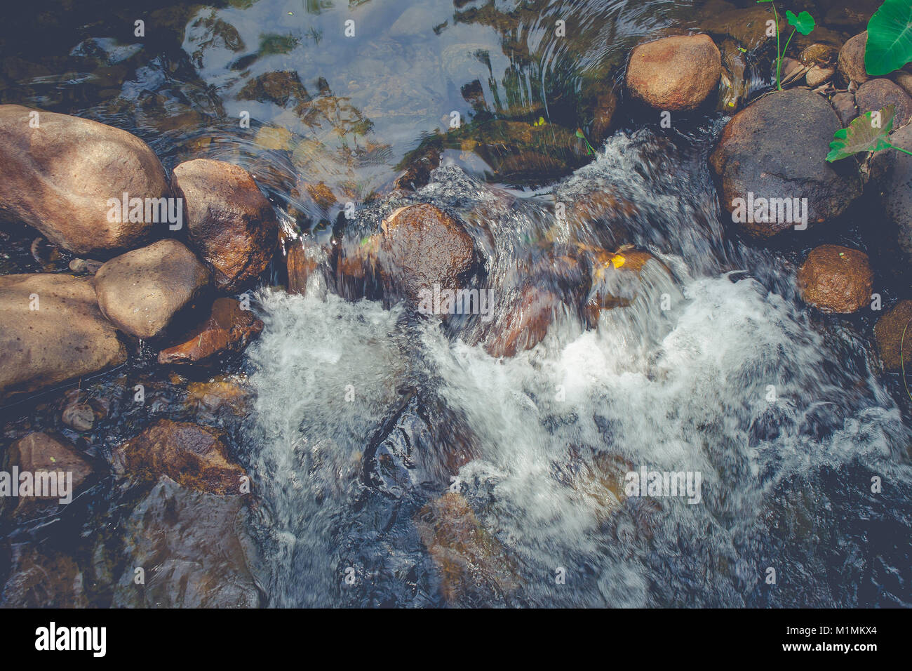 Top view beautiful small waterfall in the river with water stream ...