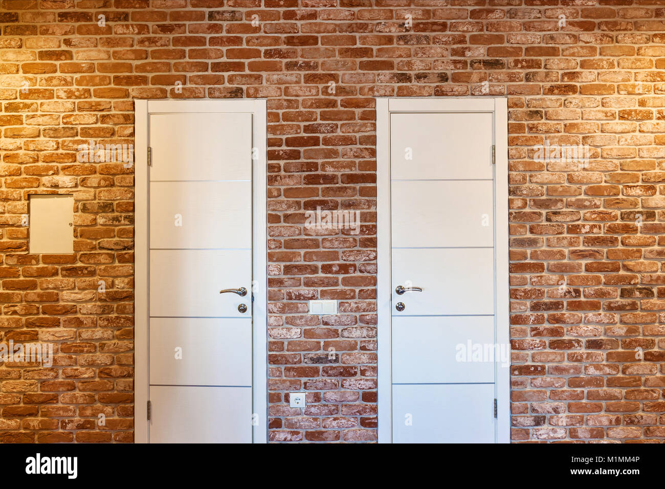Two doors in a brick wall hi-res stock photography and images - Alamy