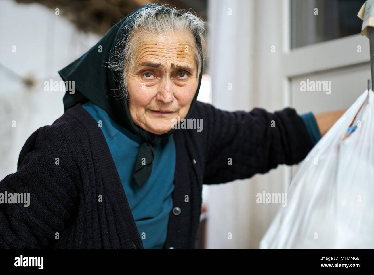 Old woman outdoor in her backyard, closeup portrait Stock Photo - Alamy