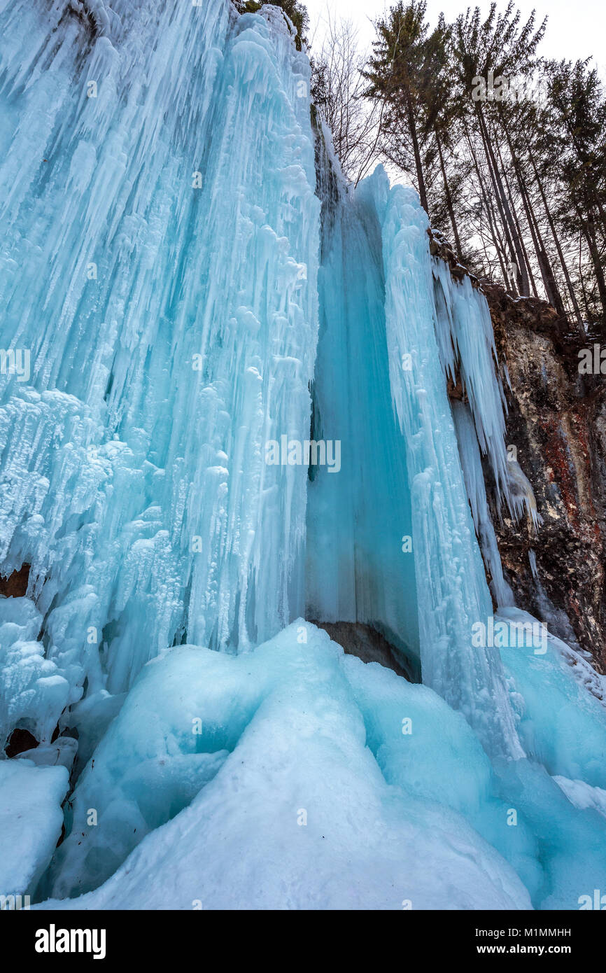 Winter landscape with a big frozen waterfall Stock Photo - Alamy