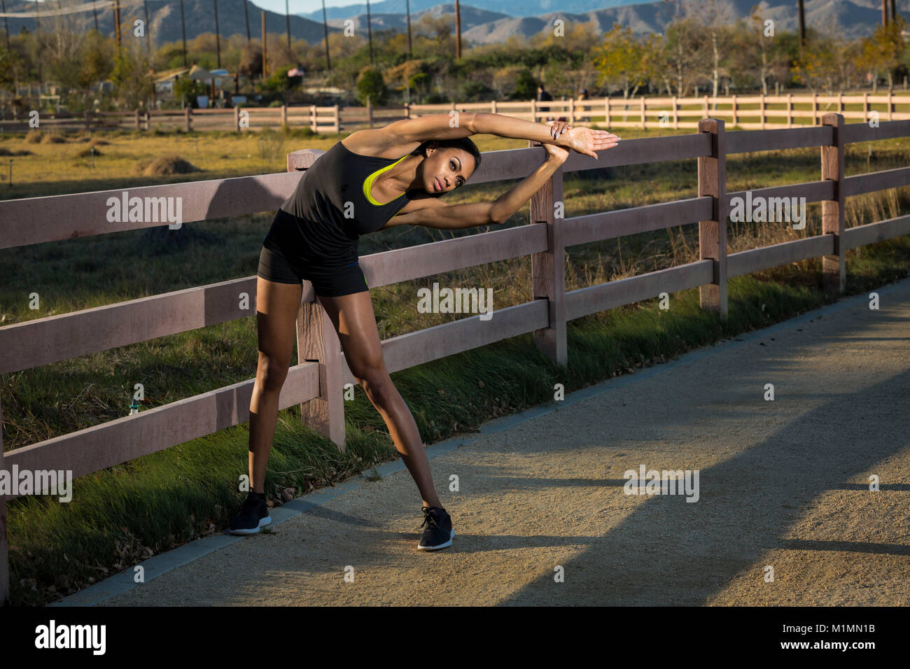 Young African American stretching on a ranch in California. Photo by ...