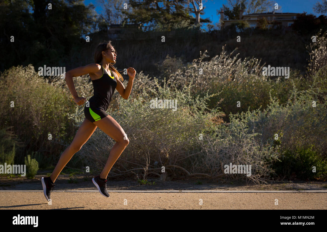 Young African American woman runs in California. Photo by Francis ...