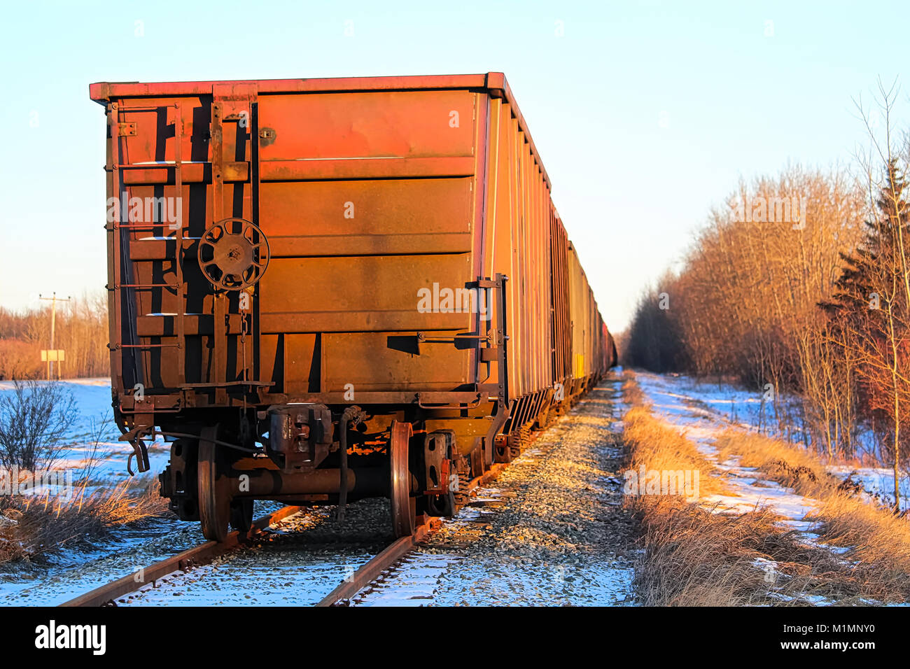 A grain train car waiting on a track Stock Photo - Alamy