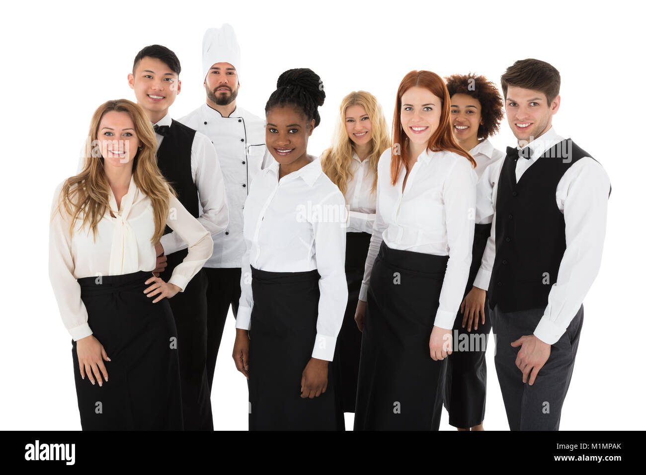 Portrait Of Confident Restaurant Staff Standing Against White ...