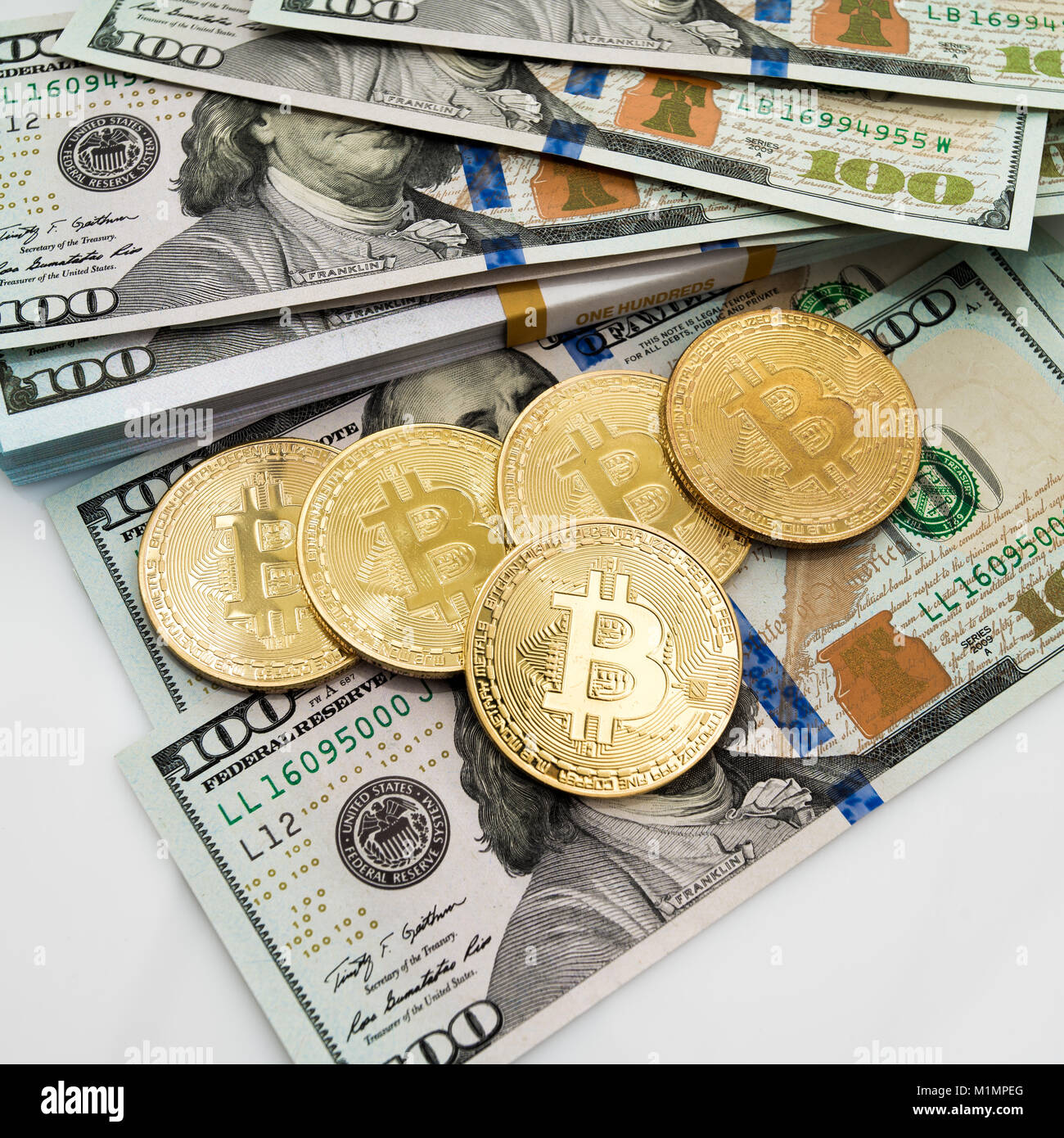 Physical version of Bitcoin and banknotes of dollar isolated on white ...