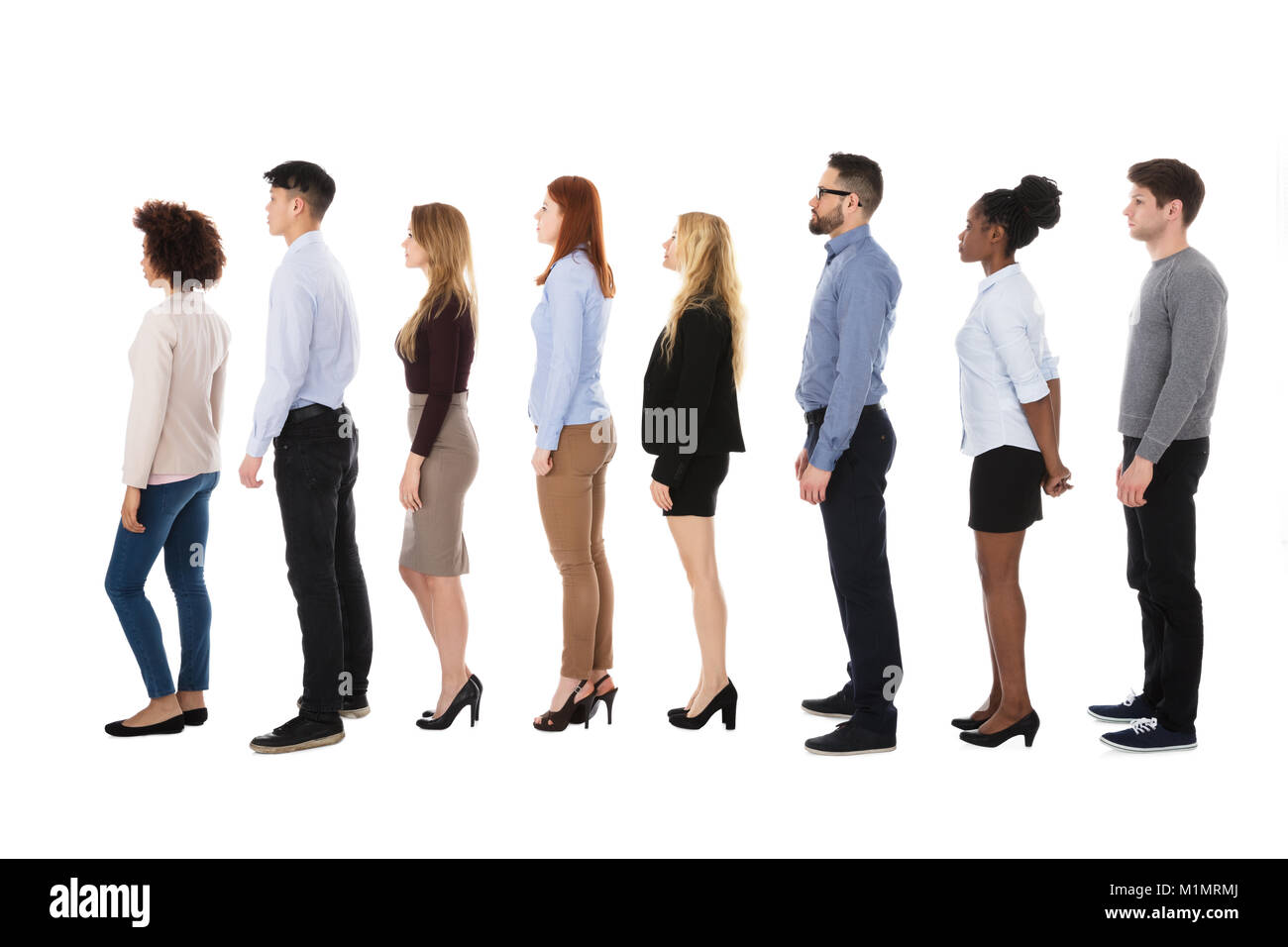 Group Of College Students Standing In Row Against White Background ...