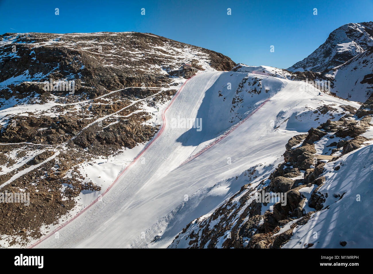 A ski run in the Bernina mountain peaks and the Diavolezza Glacier near ...